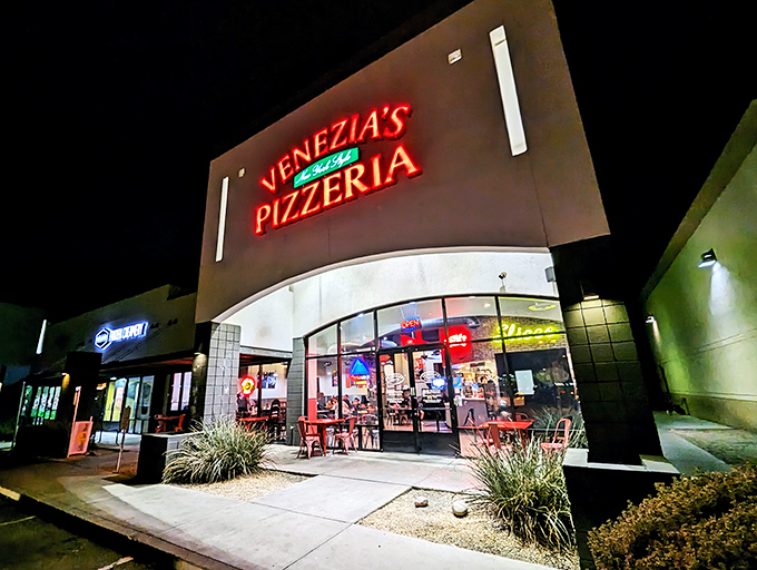 Venezia's neon sign cuts through the night like a beacon for the pizza-obsessed—New York attitude with a desert zip code.