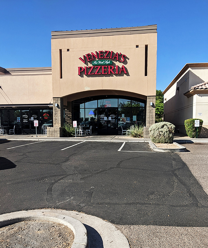 By day, it's an unassuming storefront; by night, it's where perfect New York slices are born, 2,500 miles from Times Square.