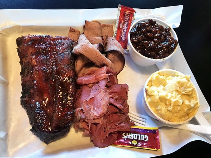 Behold, the brontosaurus of BBQ! These beef ribs are so massive, you might need a bigger plate... and a bigger belt.
