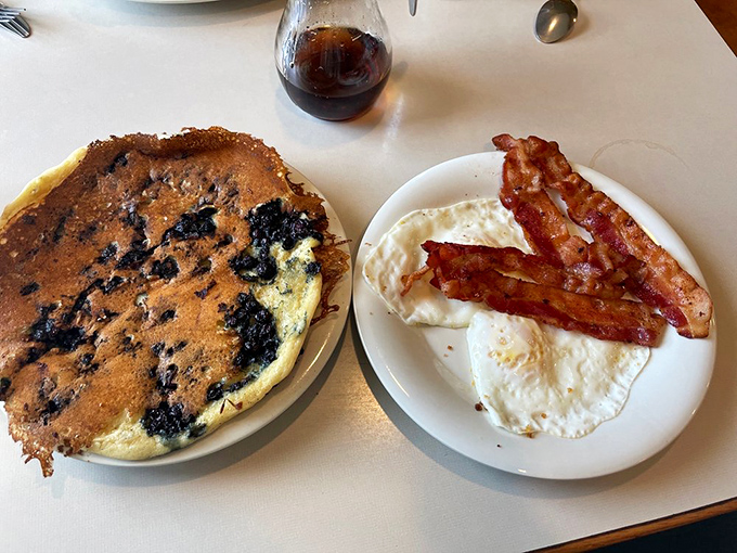 Pancake perfection! These fluffy discs of joy, studded with plump blueberries, are the breakfast of champions (and everyone else).