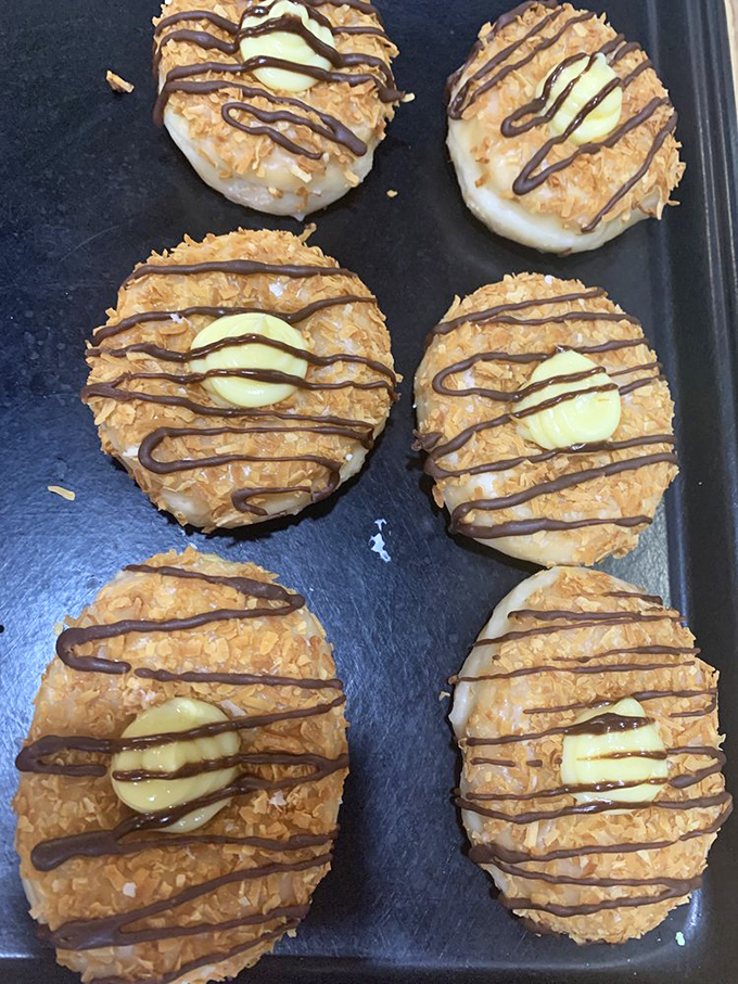 These coconut-topped creations with chocolate drizzle aren't just donuts&mdash;they're what breakfast dreams about when breakfast goes to sleep.