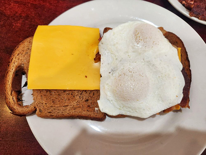 The breakfast sandwich of champions! With that perfectly fried egg and generous slice of cheese, it's like a warm, edible hug for your taste buds.