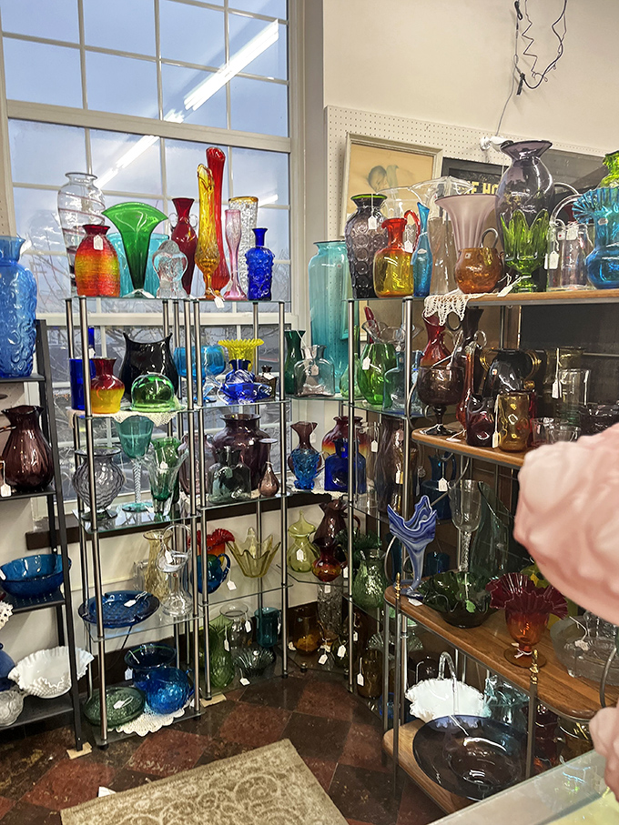 A rainbow of vintage glassware. It's like stumbling into a Technicolor dream of your grandmother's china cabinet.