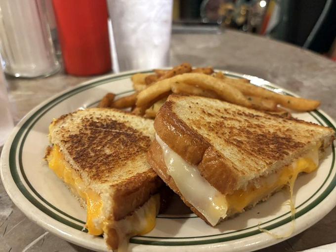 Grilled cheese perfection! Golden, crispy, and oozing with melty goodness, this sandwich is like a warm hug for your taste buds. Comfort food at its finest!