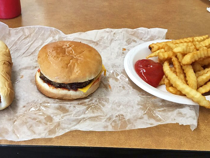 The holy trinity of diner delights: hot dog, cheeseburger, and fries. It's like a greatest hits album, but for your taste buds. Bon appétit, y'all!