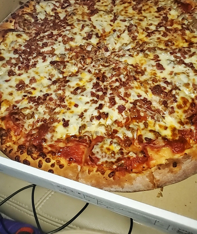 Rosa's doesn't just make pizza; they craft edible frisbees of joy. This one's big enough to feed a family or one very determined pizza enthusiast.
