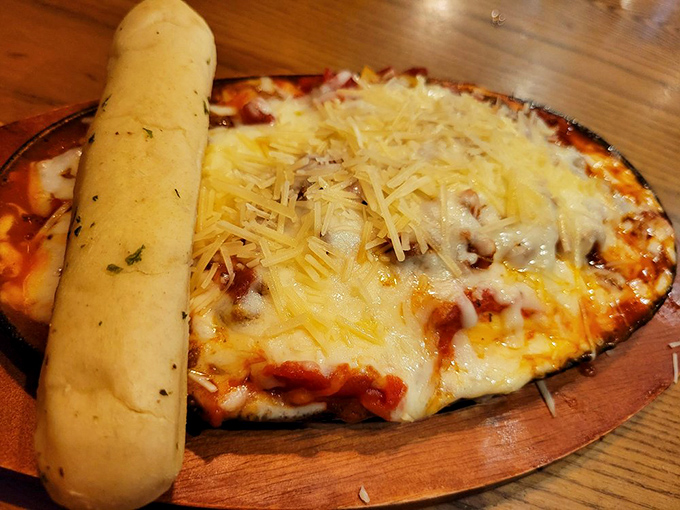 This isn't just pizza&mdash;it's a cheese-laden raft of happiness sailing on a sea of marinara, with a breadstick oar for good measure.