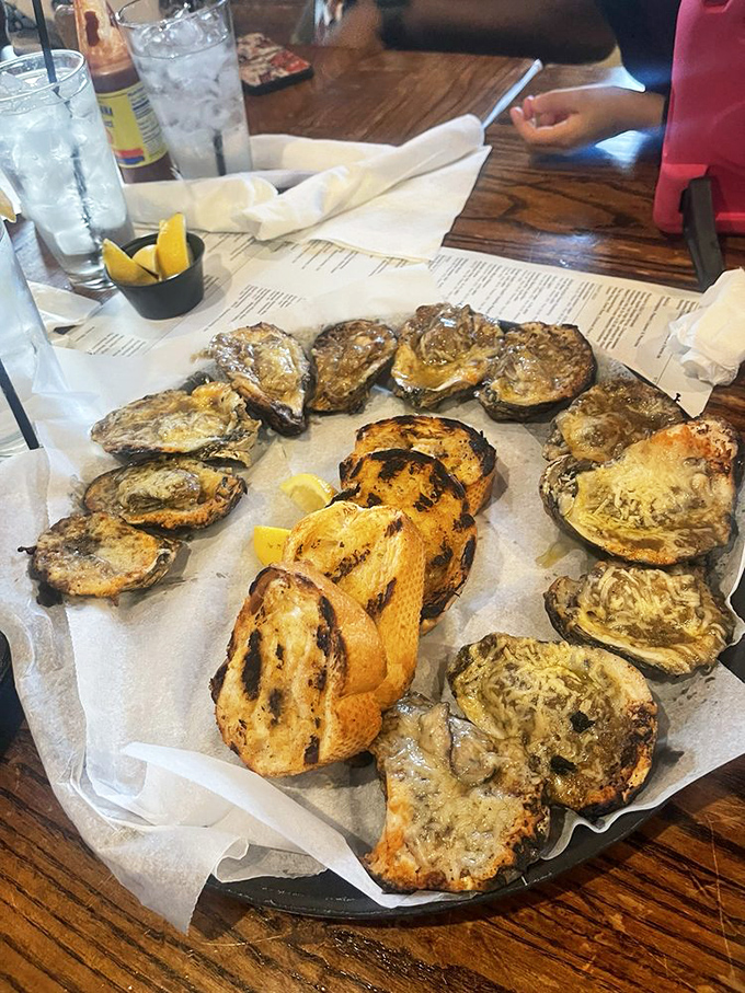 Oysters on the half shell: Nature's way of saying, "Here's a taste of the sea, served on its own dish." Grilled bread adds a smoky twist.