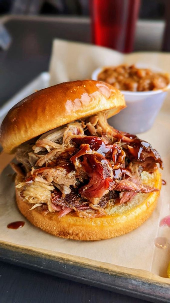 This sandwich isn't just pulled pork; it's a masterpiece of meat architecture. Da Vinci would be jealous (and hungry).