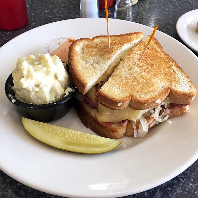 White bread rebellion! This Reuben proves it's what's inside that counts, with a crisp pickle standing guard.