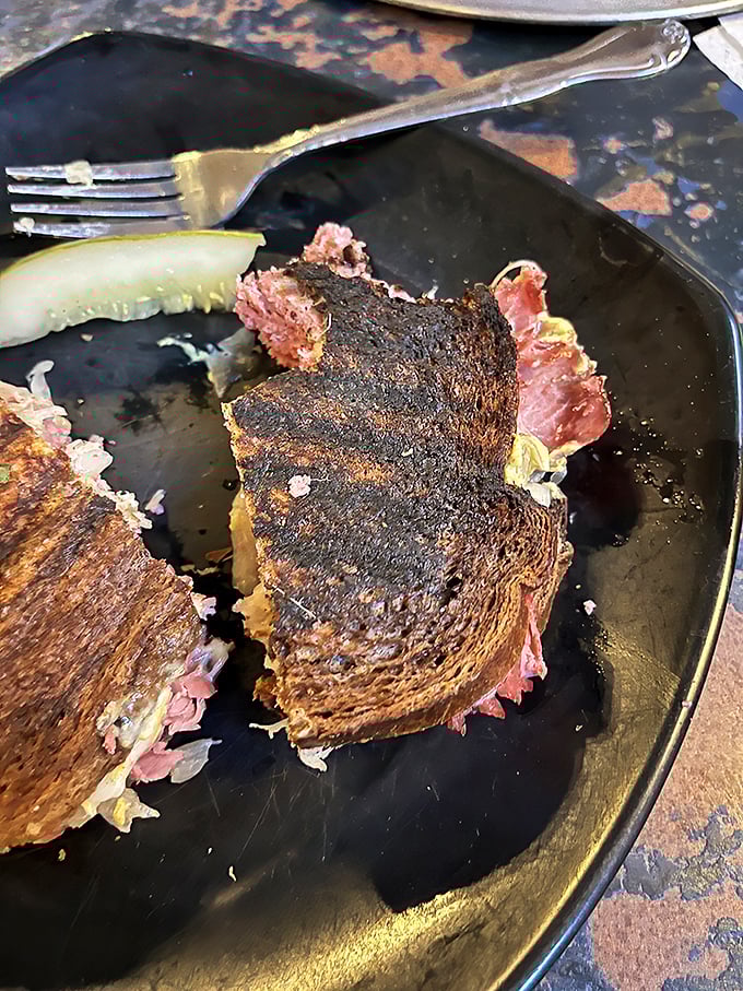 Reuben perfection, deconstructed! This cross-section view is like sandwich anatomy 101, and we're here for every delicious layer.