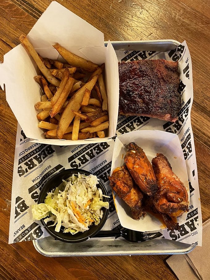 The holy trinity of BBQ: ribs, mac and cheese, and baked beans. It's like a warm, smoky hug for your stomach.