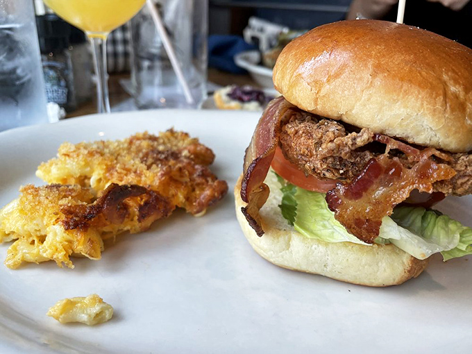 This isn't just a sandwich&mdash;it's architectural perfection with crispy bacon, juicy chicken, and mac and cheese playing backup like a delicious house band.