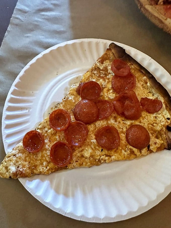 The dynamic duo: Vodka sauce and pepperoni join forces on this slice. It's like a party in your mouth, and everyone's invited!
