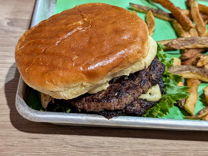 This burger isn't just a meal, it's a gravity-defying tower of deliciousness that would make Sir Isaac Newton rethink his theories.