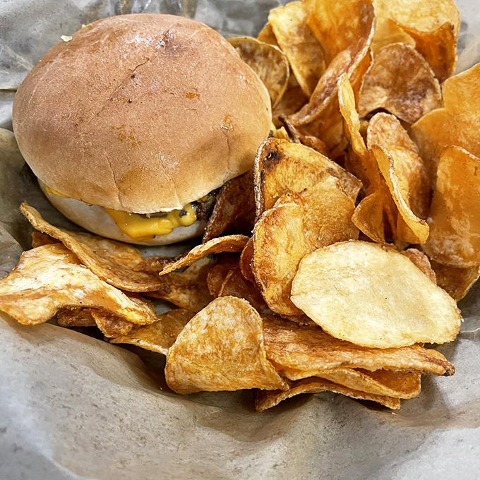 A humble cheeseburger that doesn't need to show off, with house-made chips that crackle with each satisfying bite.