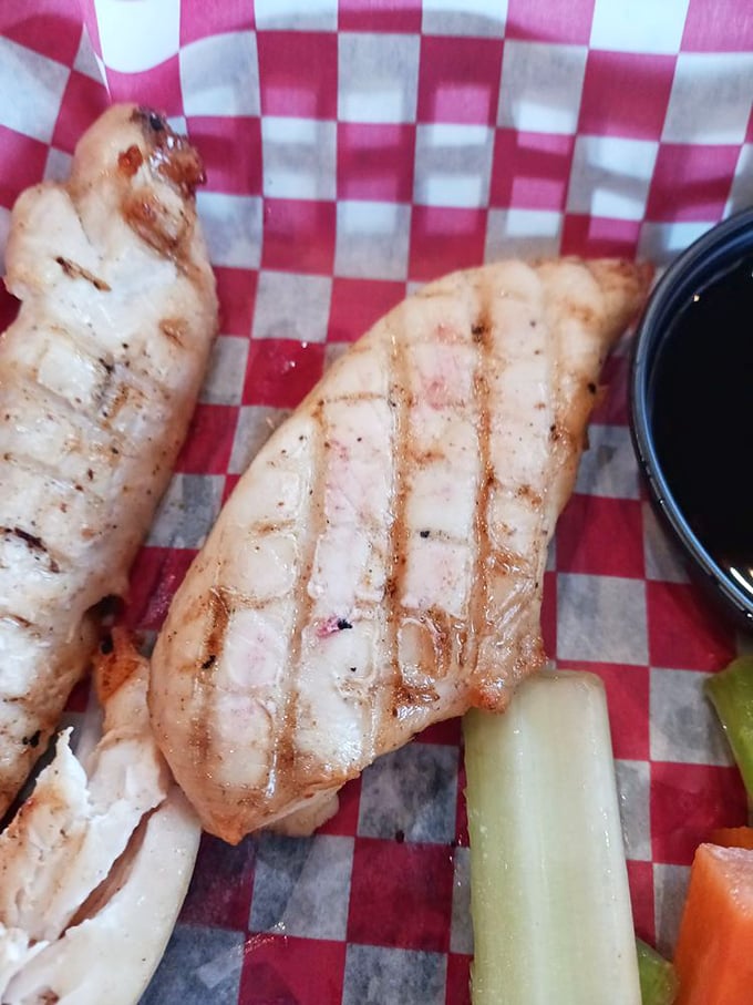 Grilled chicken strips that have clearly been introduced to fire with proper respect and a meaningful relationship with seasoning.