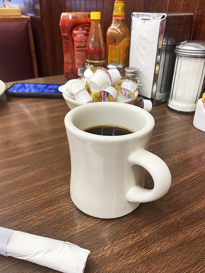 The elixir of life! This isn't just coffee; it's a warm hug in a mug, ready to turn any morning frown upside down.