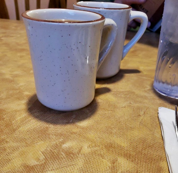 Coffee mugs standing at attention, ready to fuel your day. In a world of fancy lattes, sometimes all you need is a good ol' cup of joe and a side of diner charm.