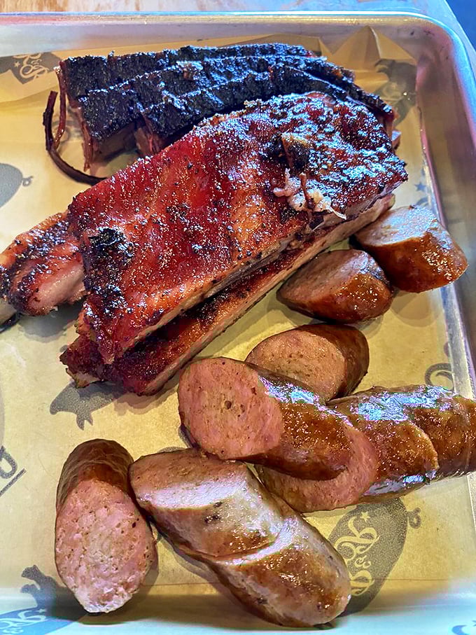 The three amigos of BBQ: brisket, ribs, and sausage. This plate is like a meaty version of "The Good, the Bad, and the Ugly" &ndash; except it's all good!