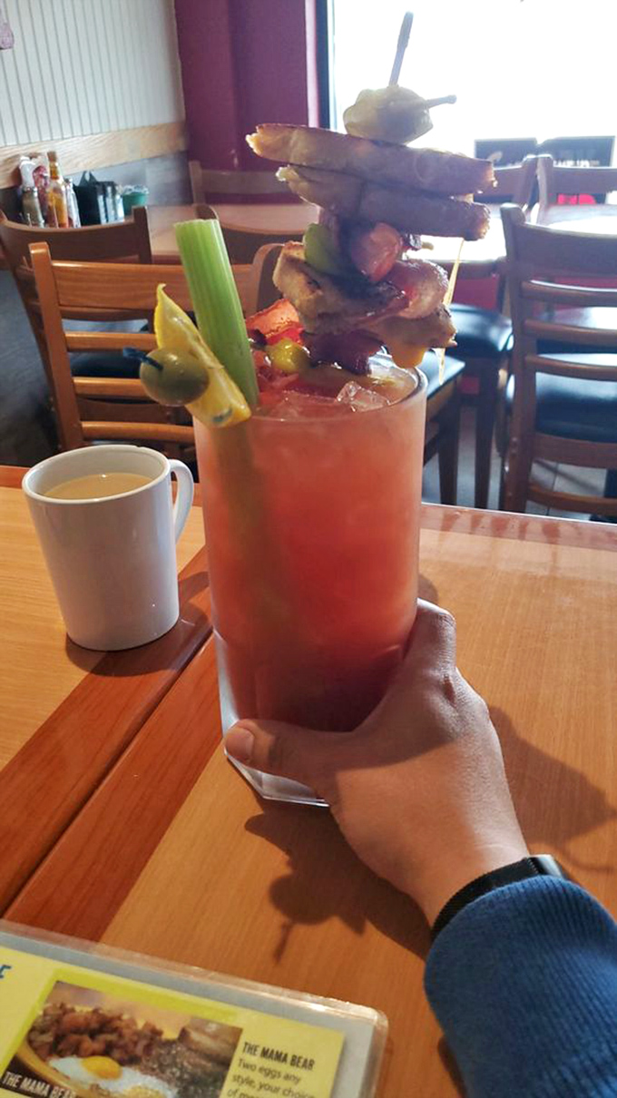 Thirsty? This Bloody Mary is like a garden party in a glass. It's got more garnishes than a Christmas tree and enough kick to wake up a sleeping armadillo.