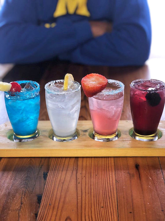 A rainbow of refreshment! These colorful drinks are like summer in a glass, each garnished with fresh fruit for that Instagram-worthy moment.