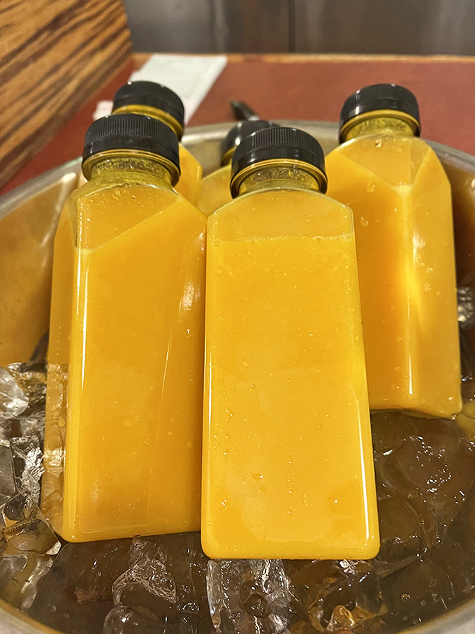 Thirst-quenching sunshine in a bottle! These vibrant yellow beverages are like liquid rays of happiness, perfect for washing down your sandwich adventure.