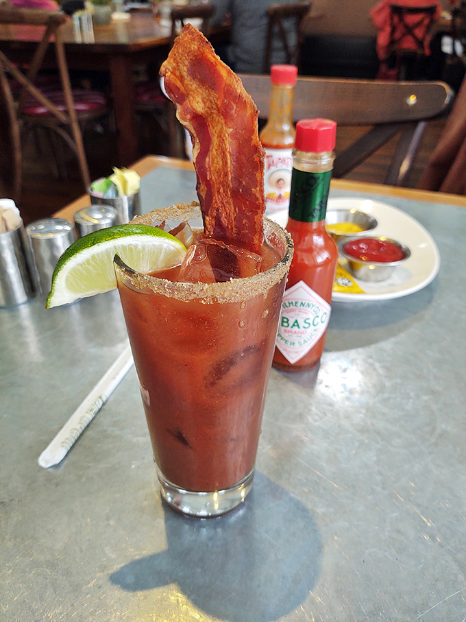 Good morning, sunshine! This Bloody Mary is like a liquid brunch, complete with a crispy bacon garnish. Hair of the dog never looked so good.