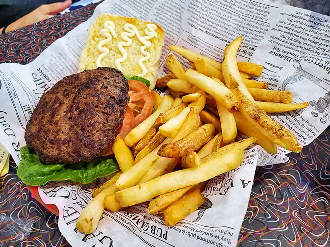 Now that's what I call a proper burger! Juicy, char-grilled perfection nestled in a pillowy bun, with a mountain of crispy fries for company.