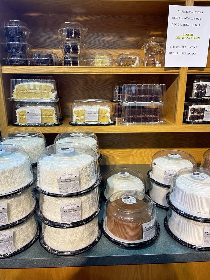 Layer cakes standing tall and proud like edible architecture. The coconut version wears its frosting like a luxurious fur coat.