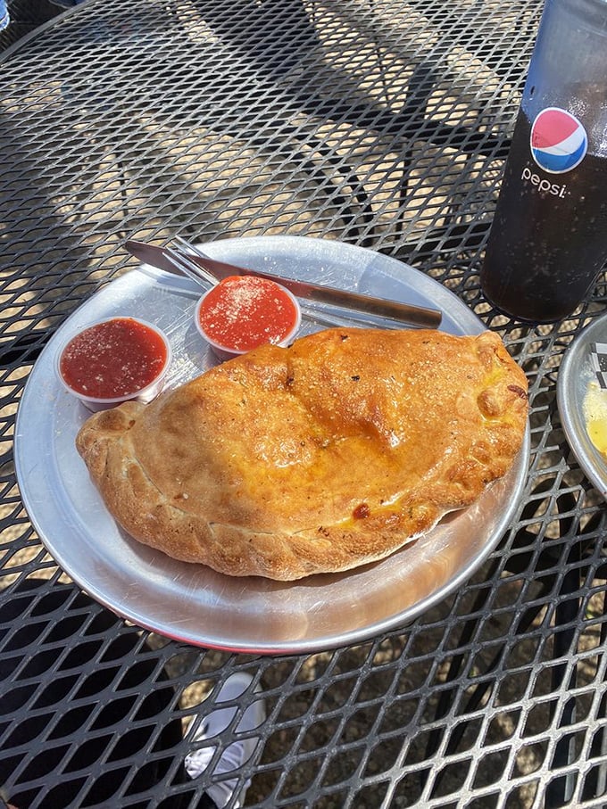 Calzone alert! This golden pocket of joy is so stuffed, it makes Mary Poppins' bag look like a coin purse.