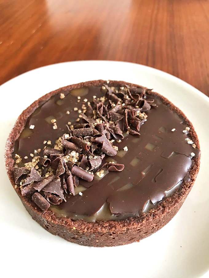 Chocolate tart or portal to dessert nirvana? This glossy wonder is so rich, it probably has its own offshore bank account.