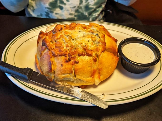 Cheese lovers, rejoice! This golden loaf is what dreams are made of &ndash; if your dreams involve swimming in melted cheese.