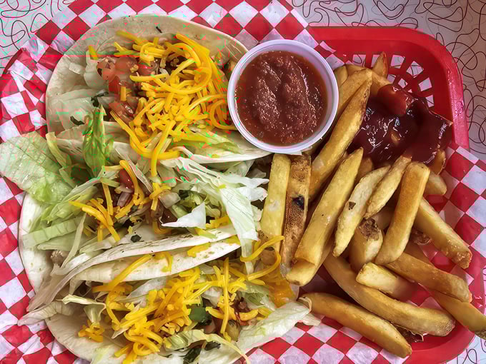 Taco 'bout delicious! These chicken tacos are dressed to impress, with a side of fries that look crispier than a fresh $100 bill.