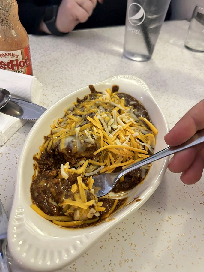 Chili dreams are made of these! This tamale swimming in chili and cheese is comfort food's answer to synchronized swimming.