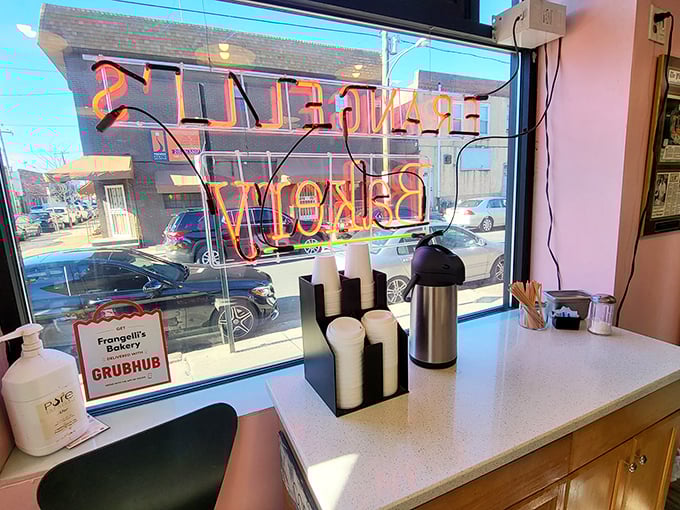 Coffee, the elixir of life, gets VIP treatment here. That neon sign isn't just decoration—it's a beacon of hope for the caffeine-deprived.
