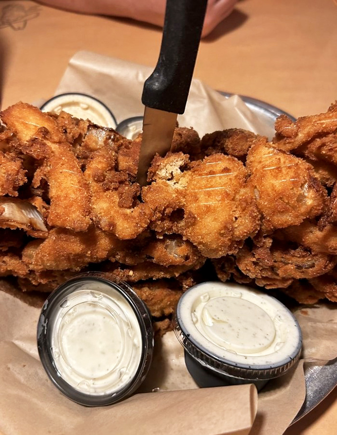 Behold the onion loaf! It's like someone took an onion ring, gave it superpowers, and turned it into a crispy, golden fortress of flavor.
