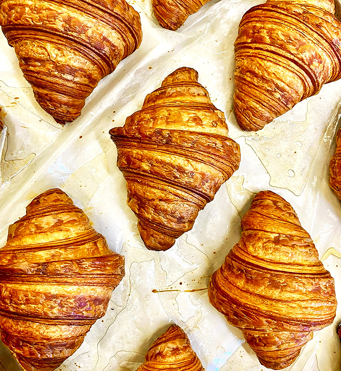 These croissants are so flaky, they make your ex look reliable! One bite and you'll be saying "Oui, oui" to seconds.