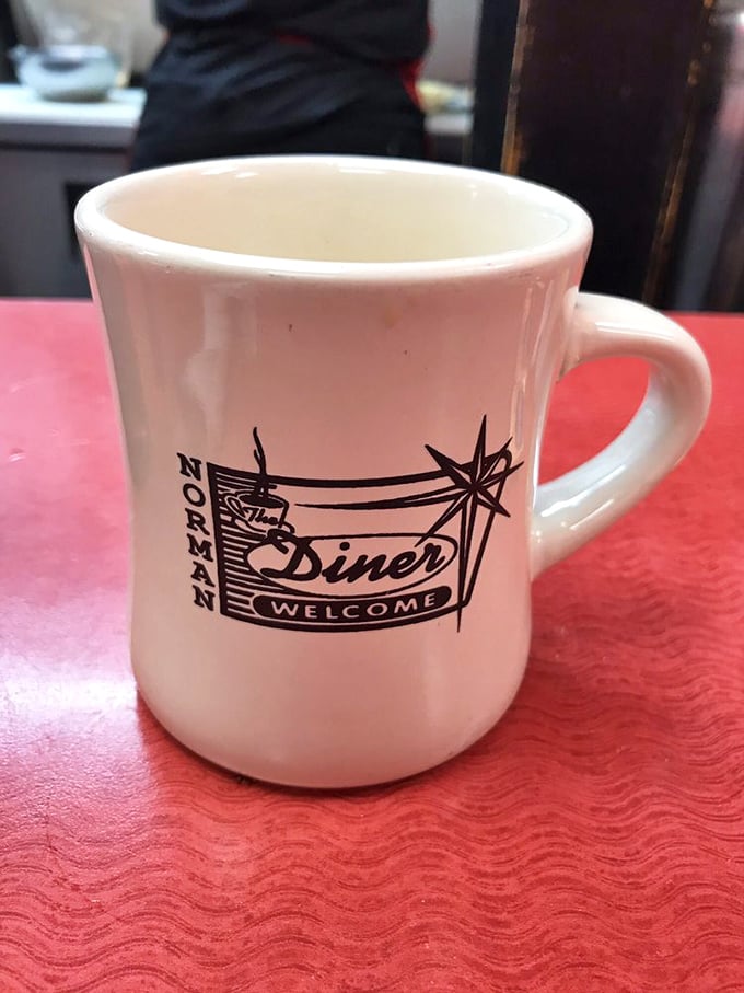 The sturdy diner mug says everything: no-nonsense coffee served in a vessel that feels like shaking hands with an old friend.
