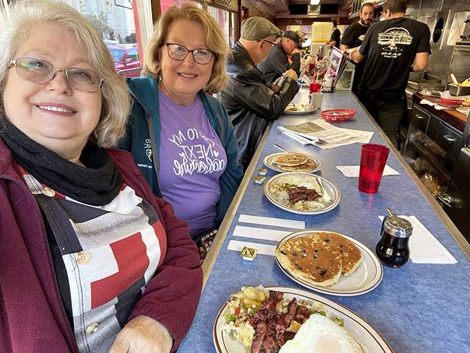 Happy customers are the best advertisement! These diners' smiles say it all &ndash; Mickey's isn't just serving food, it's dishing out joy by the plateful.
