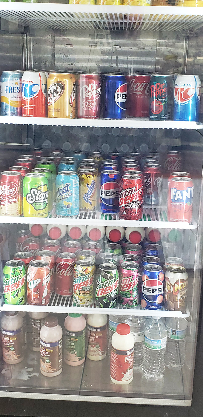 Thirsty? This fridge is stocked like a rainbow of liquid refreshment. It's like a United Nations summit for sodas.