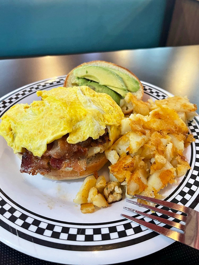 The Eastern Shore sandwich: where land meets sea on a bun. Topped with a sunny-side-up egg, it's like a culinary postcard from the Chesapeake.