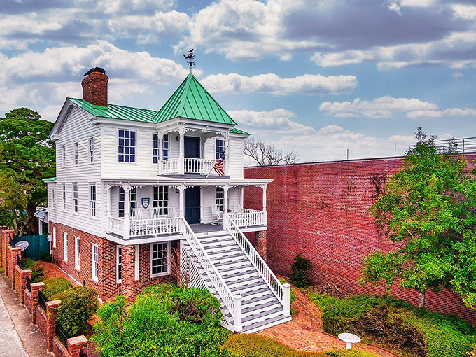 This pristine white historic building with its striking green roof and grand staircase practically demands you straighten your posture while passing by.