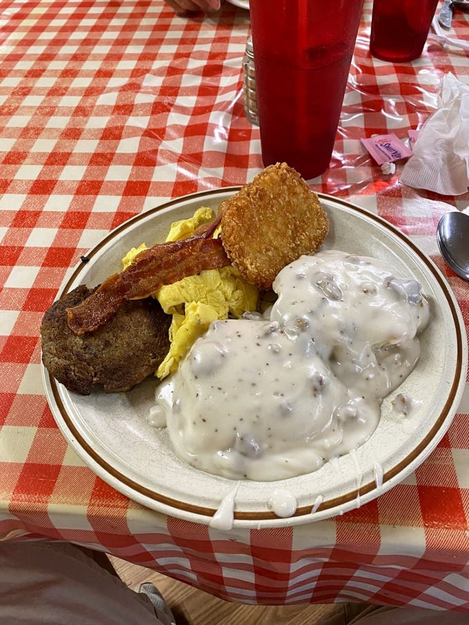 When breakfast comes with a side of breakfast! Country ham, eggs, hashbrowns, and gravy-smothered biscuits&mdash;a plate that says "you won't need lunch today."
