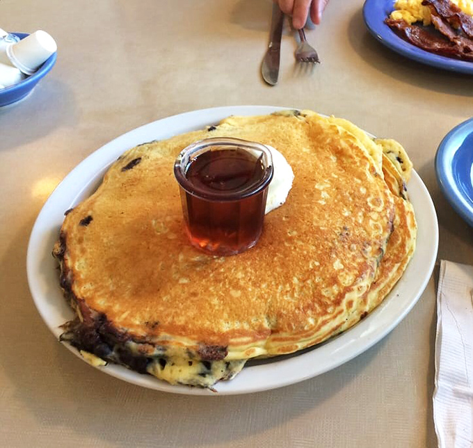 Pancakes so fluffy, they might float away if not for the blueberry anchor. Maple syrup sold separately, but highly recommended.