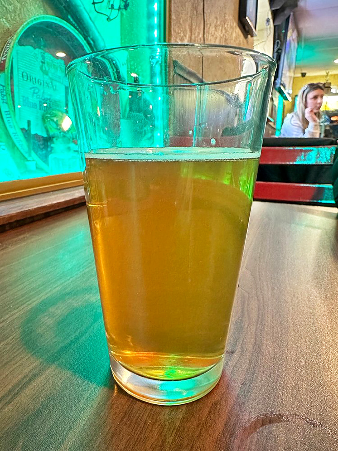 Cold beer and good lighting&mdash;the unsung heroes of any proper tavern experience. This golden pour is just waiting to cool the fire of those wings.