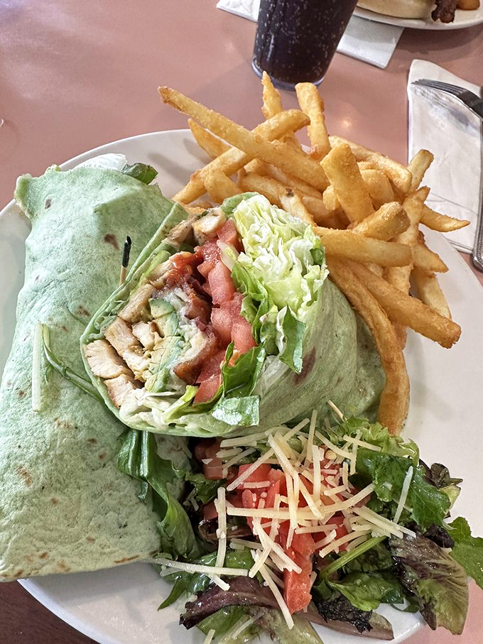 Wrap it up, I'll take it! This grilled chicken wrap is like a burrito that went to charm school - fresh, colorful, and ready to steal the show.