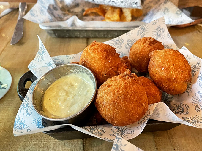Golden orbs of deep-fried perfection. These hush puppies are so good, they'll have you saying "Good boy!" to your plate.