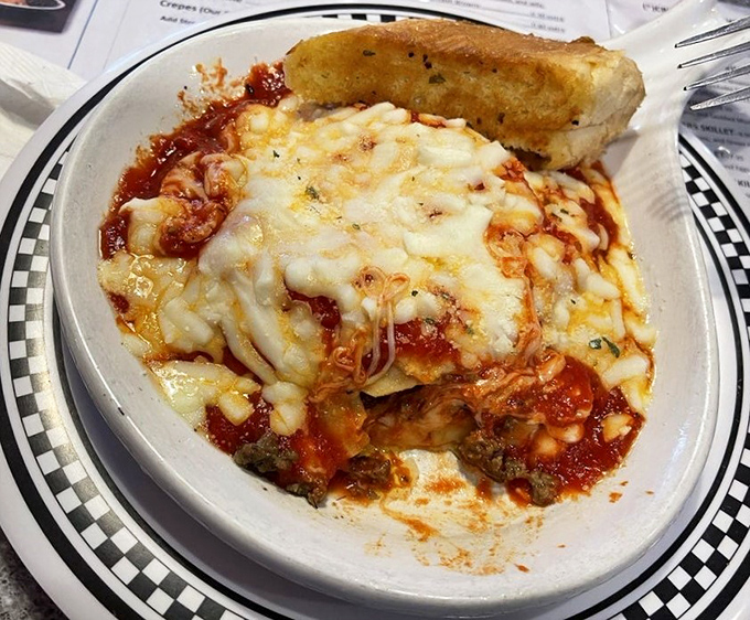 Layer upon layer of cheesy, saucy goodness. This lasagna isn't just a meal, it's an edible archaeology expedition.