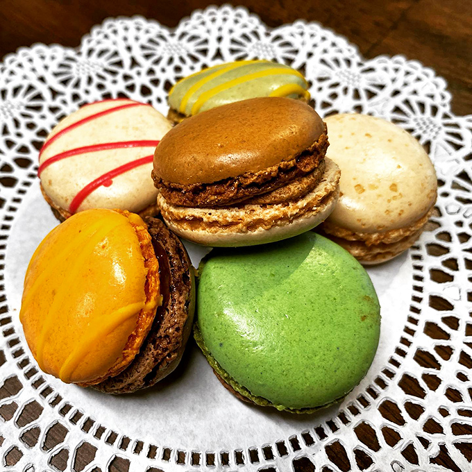 Macarons in every color of the rainbow. It's like a Parisian garden party for your taste buds!